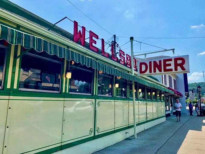 The Wellsboro Diner's distinctive green and cream exterior has been welcoming hungry travelers since the 1930s, promising classic American comfort food inside.