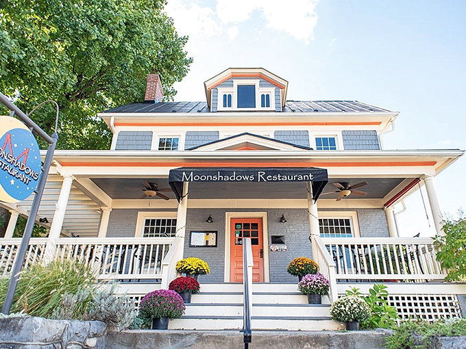 Moonshadows Restaurant's inviting porch and vibrant flowers promise meals that comfort the soul as much as they satisfy the appetite.