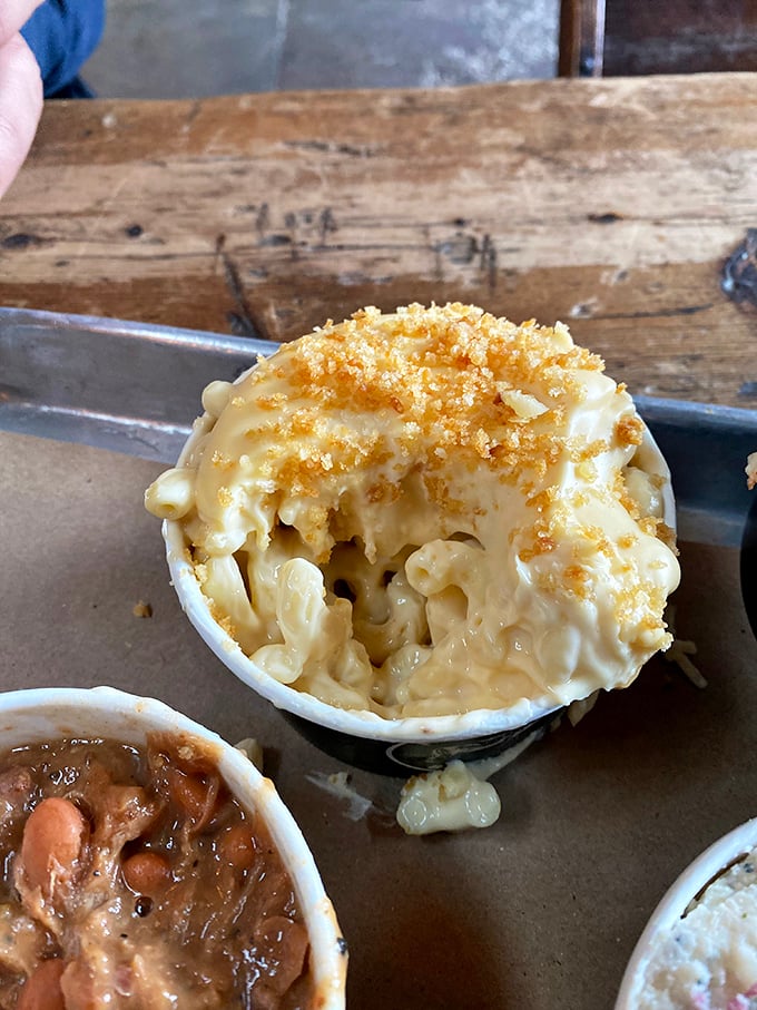 Mac and cheese with a golden crown of breadcrumbs &ndash; creamy comfort that somehow holds its own against the smokehouse stars.