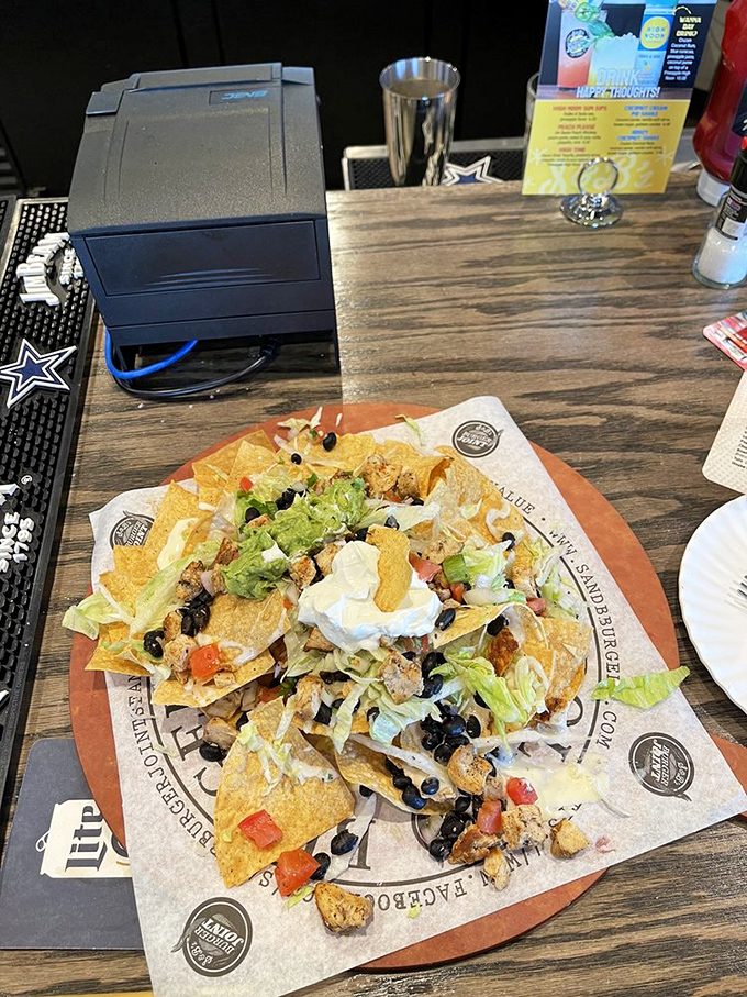 Nachos that require a topographical map to navigate—a mountain range of chips, cheese, and toppings that dares you to reach the summit.