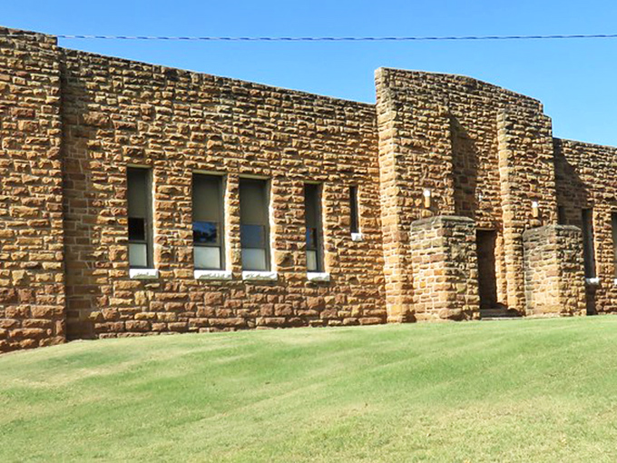 The Old State Armory's weathered stone walls have stood guard for decades, now protecting history instead of ammunition, a fortress of memories.