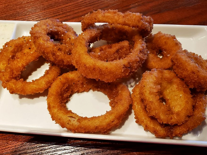These aren't just onion rings—they're golden halos of crispy perfection that deserve their own moment of silent appreciation.
