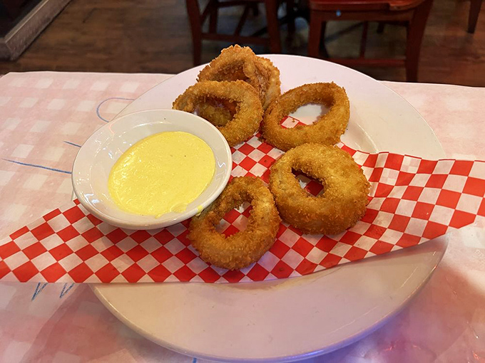 Onion rings with the perfect crunch-to-tenderness ratio, served with a dipping sauce that makes you question your lifelong relationship with ketchup.