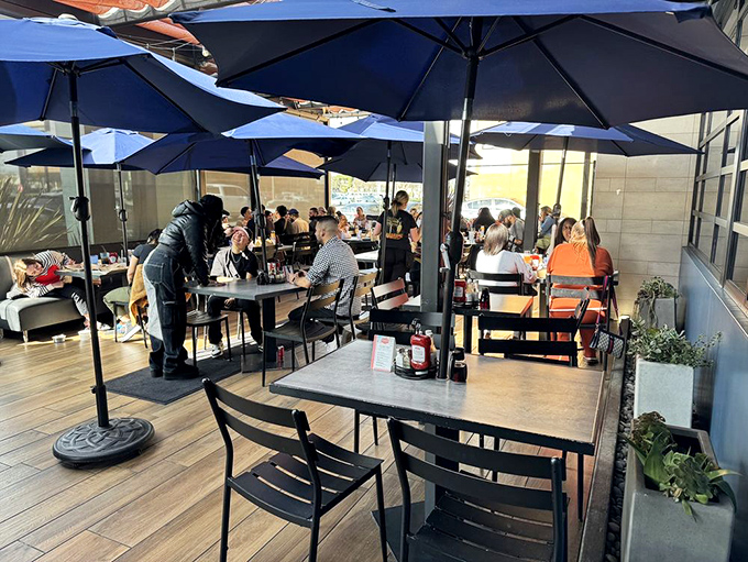 California outdoor dining at its finest. Those blue umbrellas don't just provide shade&mdash;they're portals to the Mediterranean vacation you didn't know you needed.