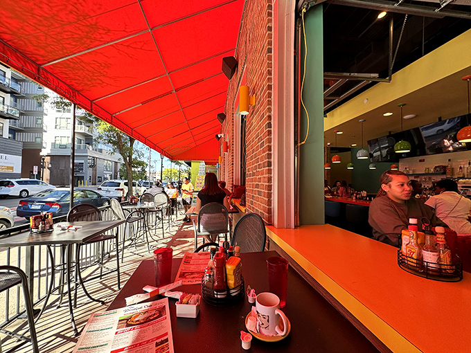 Al fresco dining Minneapolis-style: the moment when the sun hits the red awning just right and your coffee arrives at peak temperature&mdash;urban breakfast nirvana.