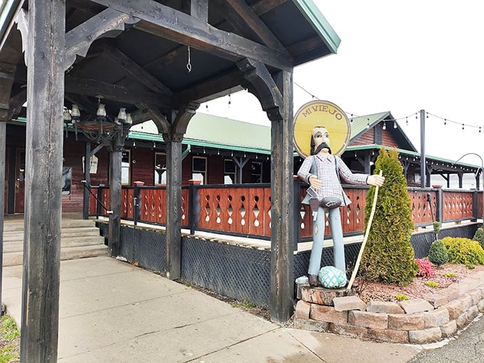 Outside, the wooden porch and whimsical statue stand guard, inviting passersby to discover what locals already know: this place is special.
