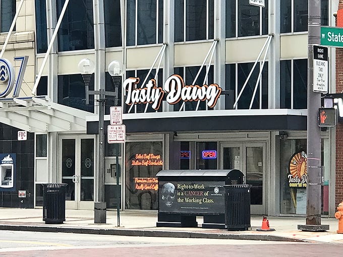 The street view reveals Tasty Dawg's prime downtown Columbus location, perfectly positioned for midday cravings and post-event satisfaction.