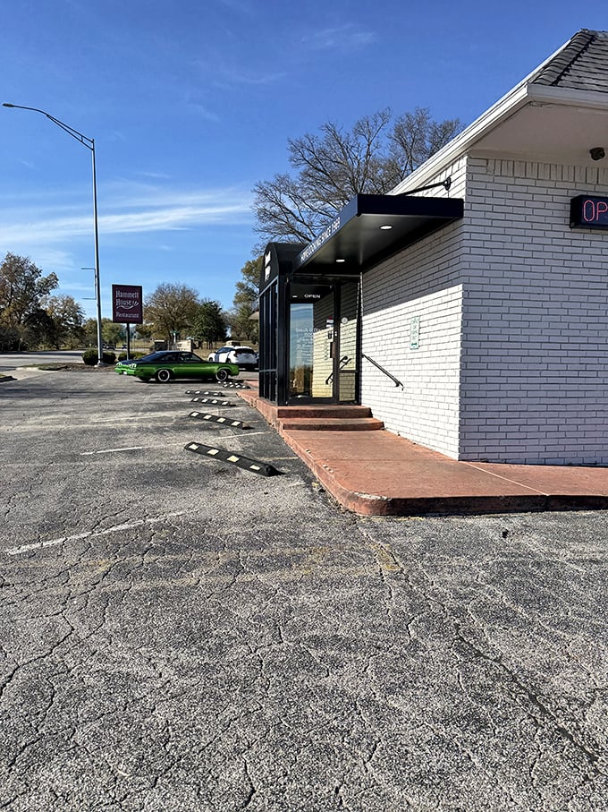 The modest entrance belies the culinary treasures within. That "OPEN" sign might be the most honest advertising in Claremore.