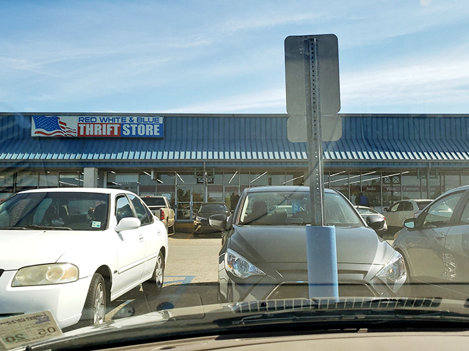 The parking lot view that bargain hunters know well. Full spaces mean good finds inside&mdash;thrifters' version of "if it's crowded, the food must be good."