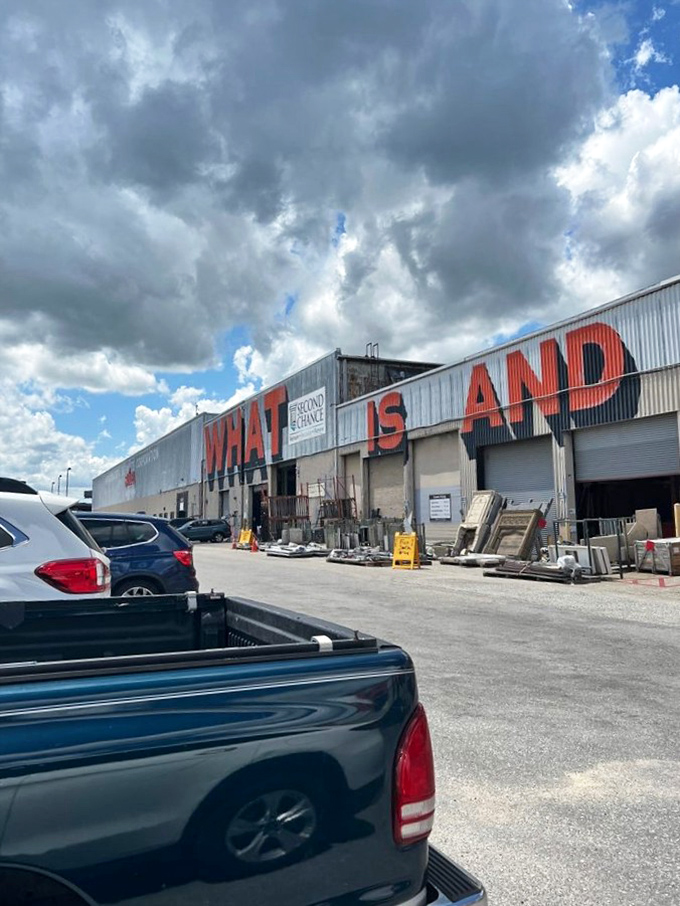The exterior's "WHAT IS AND" signage poses an existential question that can only be answered by venturing inside this cathedral of reclaimed treasures.