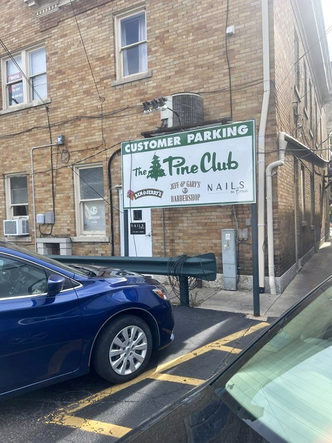 Even the parking sign carries that distinctive Pine Club charm &ndash; a final reassurance that you've arrived somewhere special.