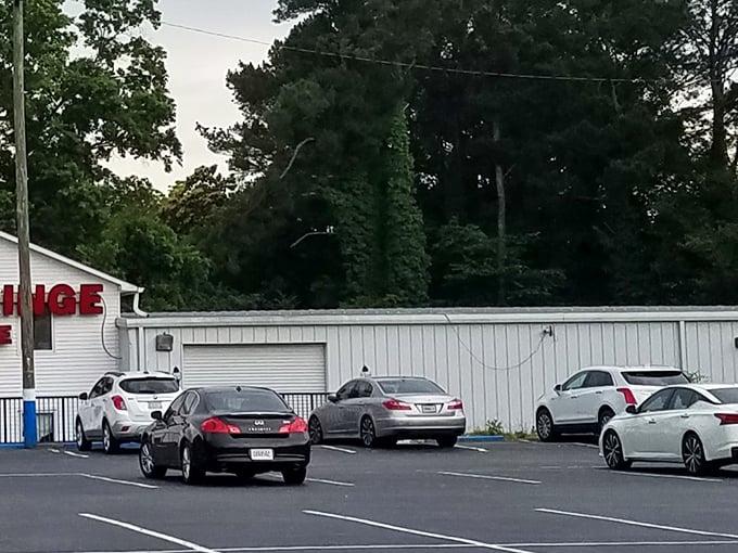 Even the parking lot knows this is serious business. Cars patiently wait while their owners make life-changing fabric decisions inside.