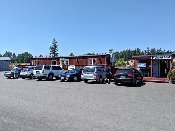 The unassuming parking lot&mdash;where ordinary vehicles wait while their owners temporarily upgrade to machines built purely for the thrill of speed.