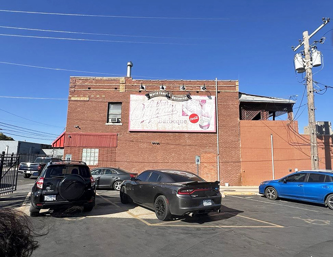 The modest parking lot of a barbecue landmark. Those cars contain lucky people who will soon be experiencing meat-induced euphoria.