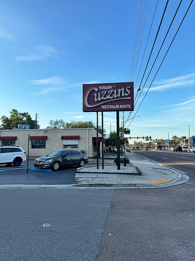 Morning light bathes the Kissin' Cuzzins exterior in Florida sunshine, promising another day of no-nonsense breakfast excellence on 34th Street.