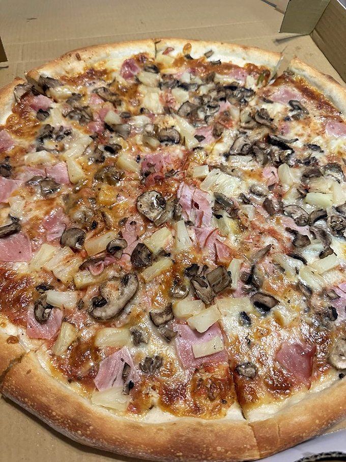 Pizza that makes you question why you ever settled for delivery&mdash;a harmony of ham, mushroom, and pineapple that silences the topping debate.