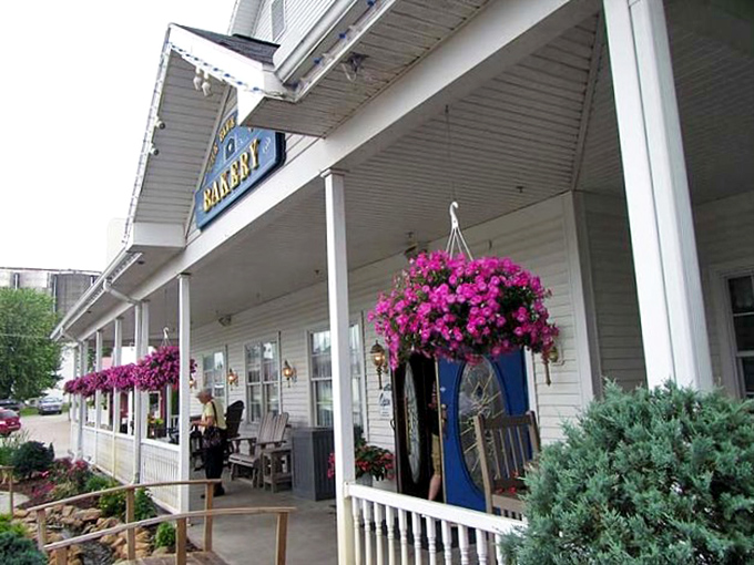 The iconic blue-trimmed white exterior stands as a beacon of hospitality, promising authentic flavors within those welcoming doors.