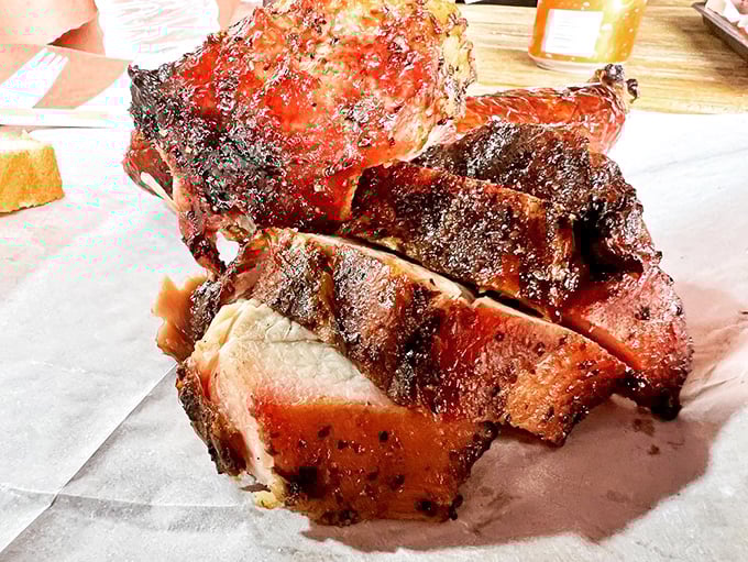 These pork ribs have the kind of bark that makes you want to write poetry, with meat so tender it falls off the bone with just a stern look.