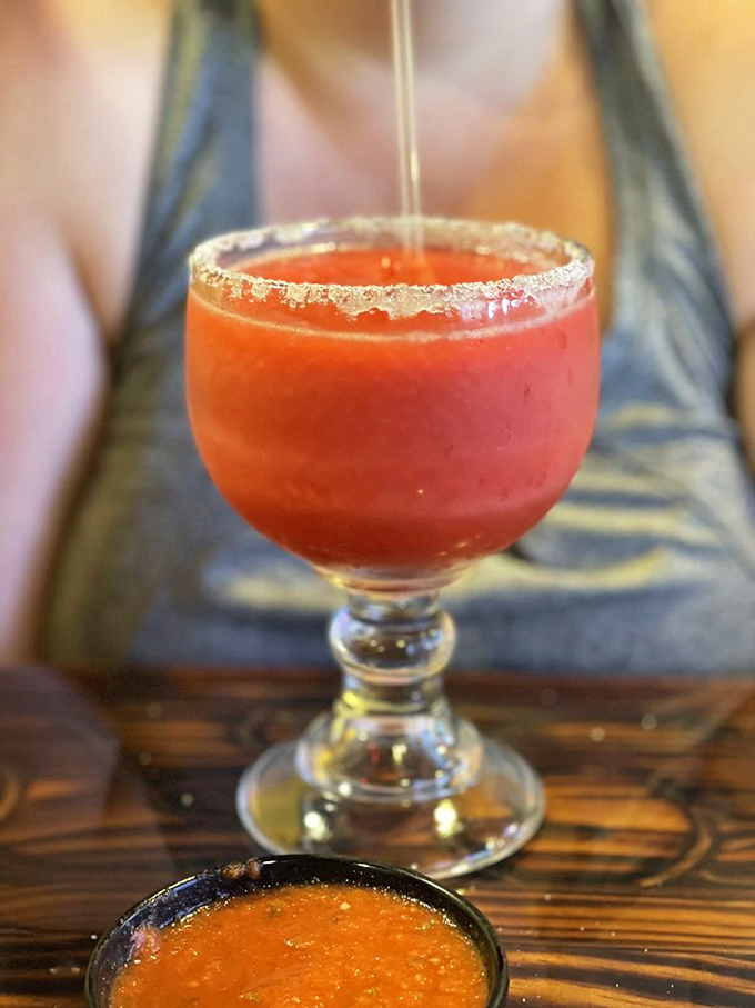 A raspberry margarita with that perfect salt rim&mdash;where fruit meets tequila in a vacation-worthy glass. Sipping required, responsibilities optional.