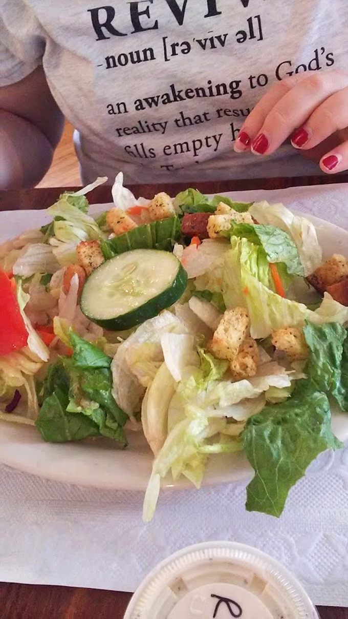 A house salad that doesn't apologize for being exactly what it claims to be &ndash; fresh, honest, and ready to balance out that pie you're eyeing.