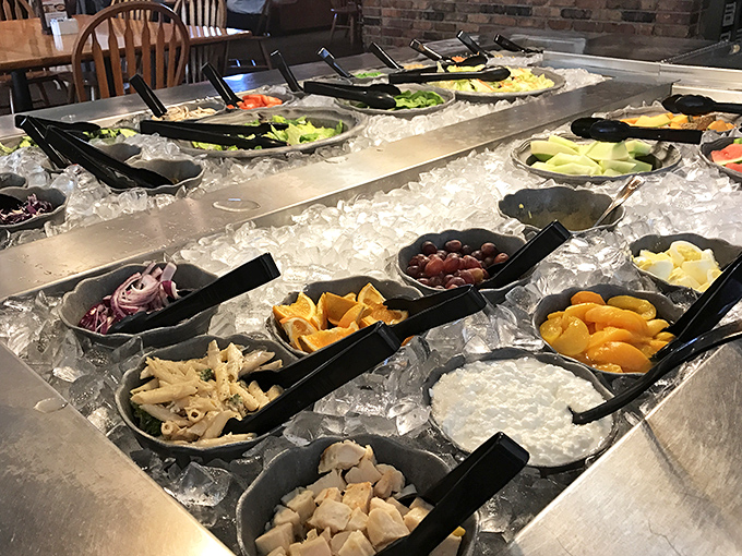 The salad bar stands as a monument to the lie we tell ourselves: "I'll eat healthy before demolishing that slice of chocolate cream pie."