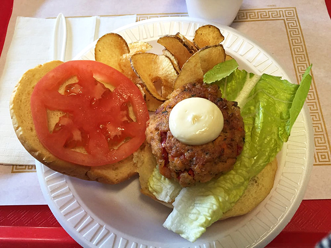 This isn't just a sandwich&mdash;it's architecture. The perfect stack of bun, lettuce, tomato, and seafood patty creates the Taj Mahal of lunch options.