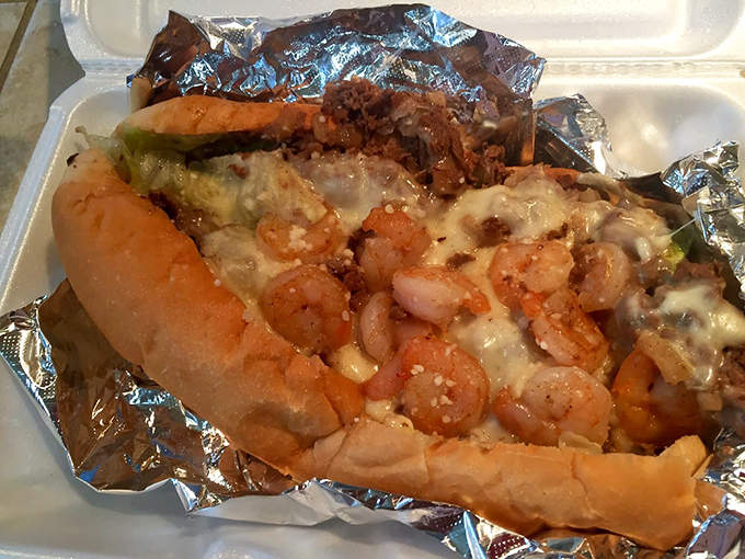 The shrimp cheesesteak&mdash;where land meets sea in a sandwich that shouldn't work but absolutely does. Culinary rebellion at its finest.