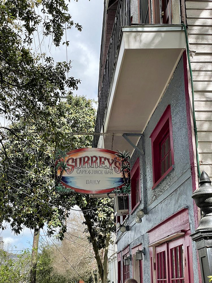 The vintage-style sign swings gently in the New Orleans breeze, marking the spot where breakfast dreams come true seven days a week.
