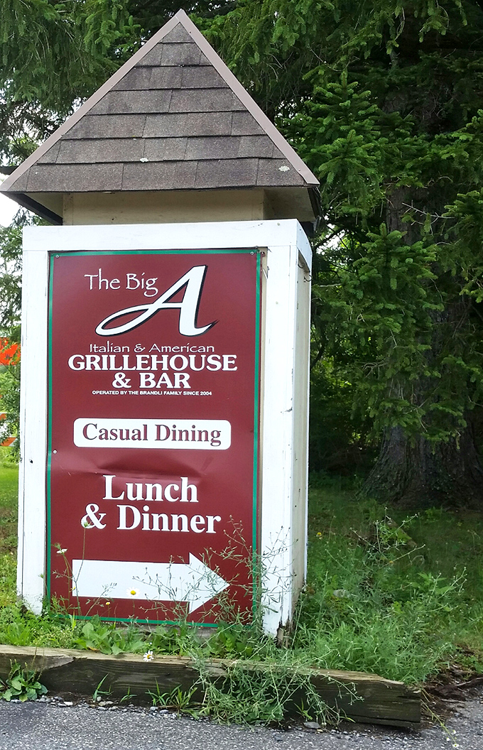The roadside sign promises exactly what awaits&mdash;a casual dining experience worth following directional arrows to find.