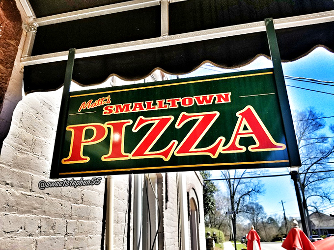 The sign that's guided pizza pilgrims for years. Like a lighthouse for the hungry, it beckons with promises of cheesy, saucy salvation.