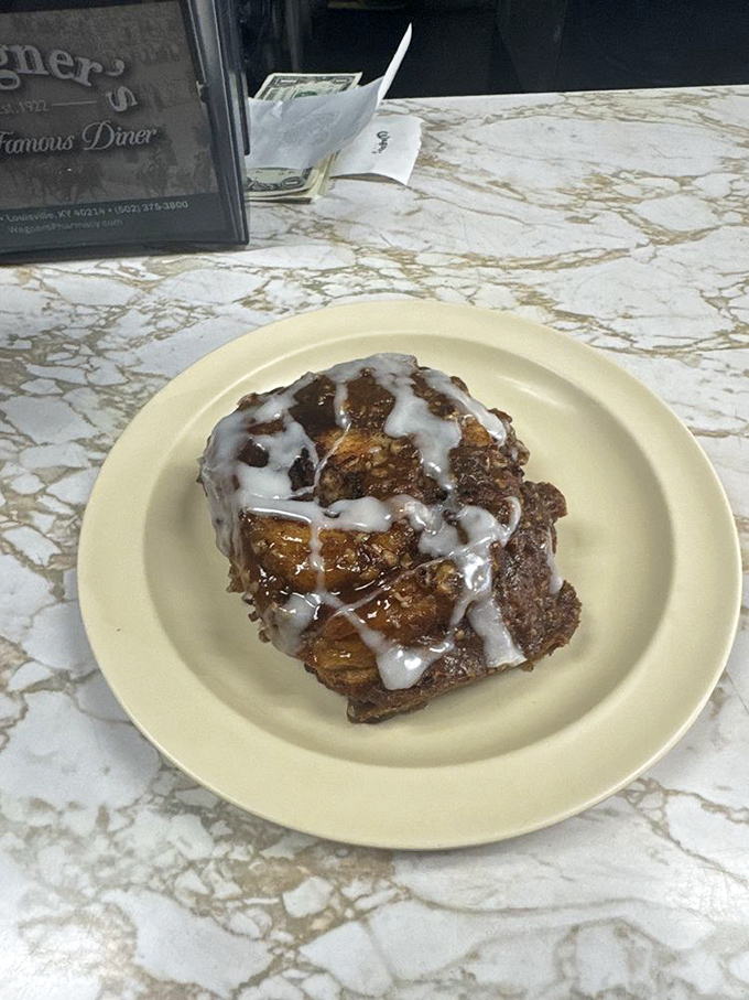 This sticky bun isn't just dessert—it's a sweet victory lap after conquering the breakfast menu. Worth every delicious calorie.