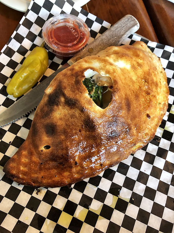 The stromboli: pizza's sophisticated cousin wrapped into a golden-brown pocket of joy, served with a side of deliciously tangy marinara.