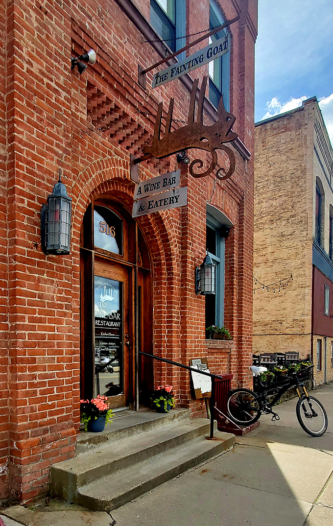 The Fainting Goat's rustic brick entrance and metal elk sign promise the kind of dining experience where "farm-to-table" isn't a trend&mdash;it's just Tuesday.