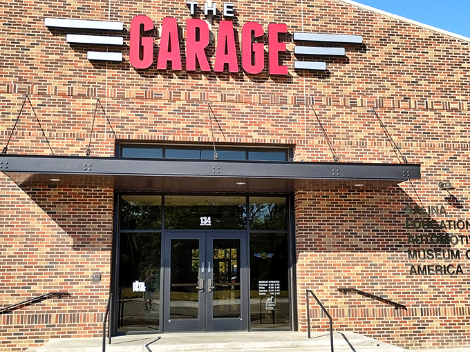 "The Garage" entrance welcomes visitors with a nostalgic nod to America's love affair with automobiles &ndash; less a museum, more a mechanical love letter.