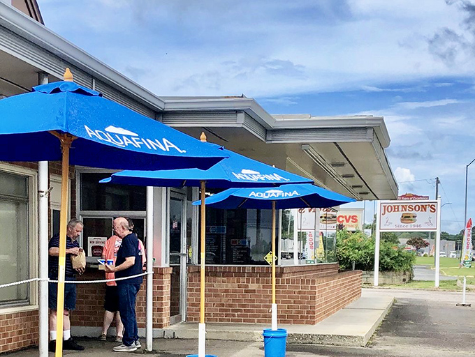 When the blue umbrellas come out, you know you're in for a treat that transcends the humble takeout window it comes from.