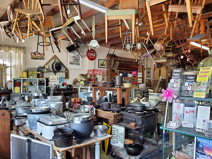 Look up and be rewarded! The ceiling becomes additional display space where chairs, signs, and Americana create a floating museum of everyday life.