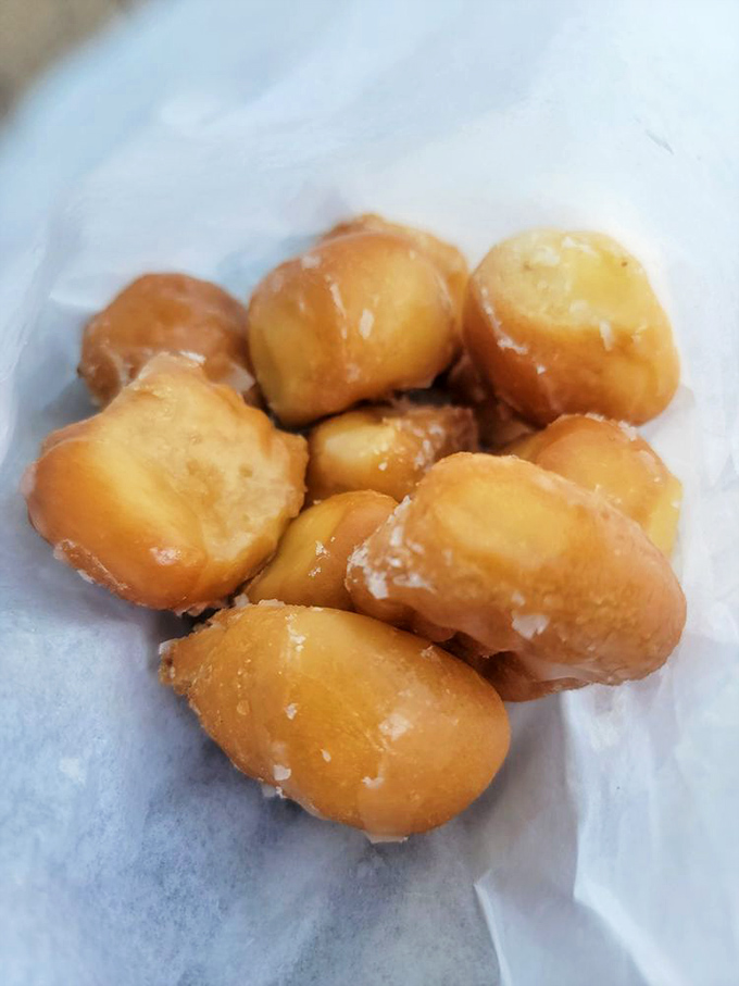 Donut holes that prove the best things come in small packages – pop-able perfection that disappears faster than your New Year's resolutions.
