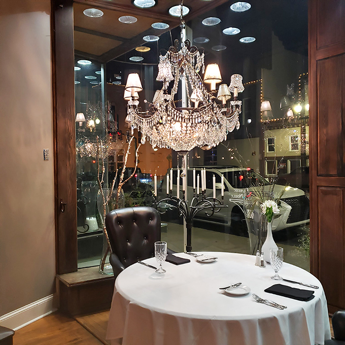 A table for two beneath a chandelier that's seen countless celebrations. The view outside reminds you that sometimes, magic happens in small-town Alabama.