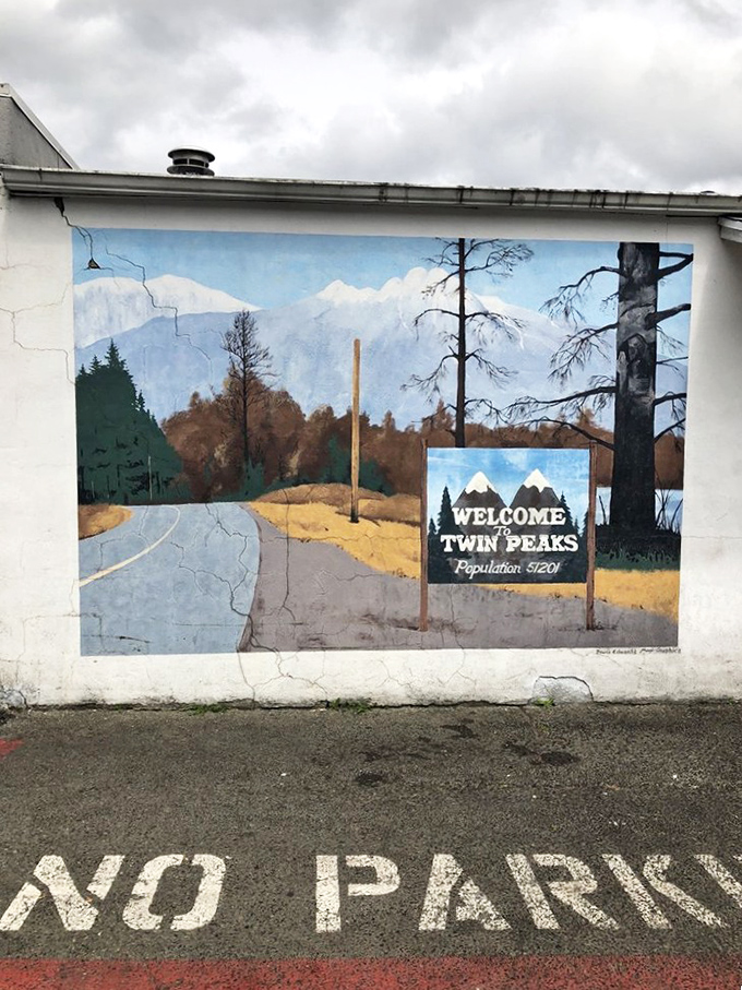 The "Welcome to Twin Peaks" mural reminds visitors they're in a place where television history and incredible pie create the perfect small-town magic.