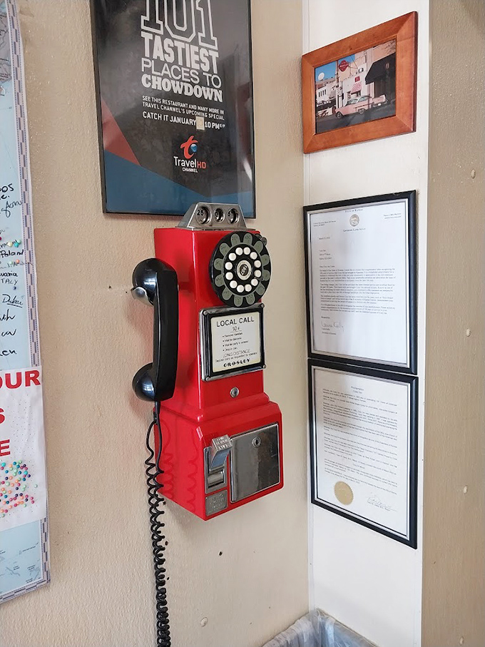 Even the Travel Channel knows a national treasure when they taste one. That vintage payphone has heard countless slider-induced exclamations.