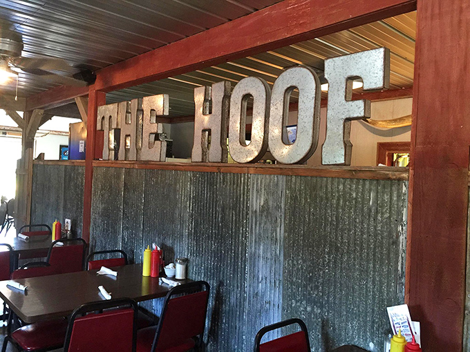 Vintage-inspired metal letters announce "THE HOOF" against corrugated metal &ndash; no fancy script needed when your reputation speaks for itself.