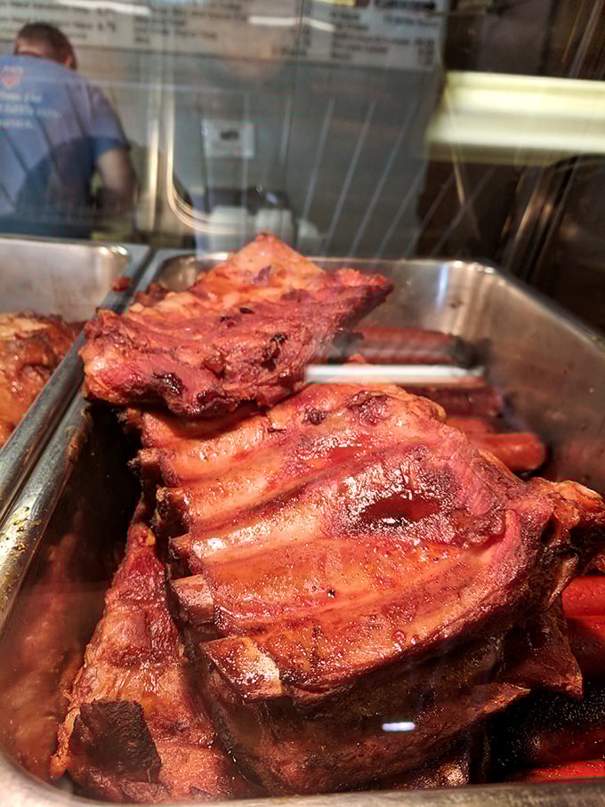 These ribs, glistening with sauce and smoke, are the reason people drive from three counties away on a random Tuesday.