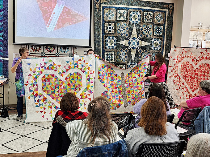 Show-and-tell for grown-ups&mdash;where finished quilts become textile celebrities and their creators bask in well-deserved applause.