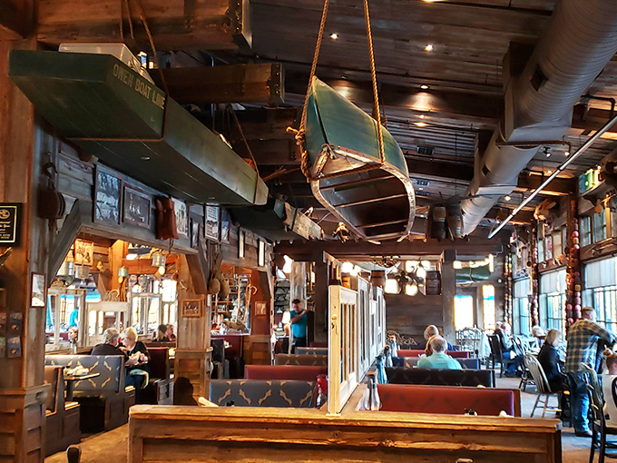 Canoes hanging from the ceiling remind you that dinner here isn't just a meal—it's a landlocked maritime adventure.