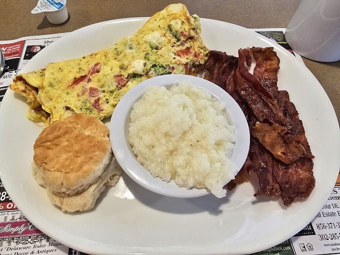 The breakfast plate that says "I'm serious about starting my day right"&mdash;a Western omelet, grits, bacon, and a biscuit that means business.