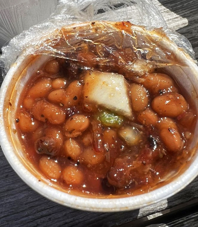 Baked beans with bits of meat swimming in sweet, tangy sauce&mdash;proof that side dishes can steal the show.