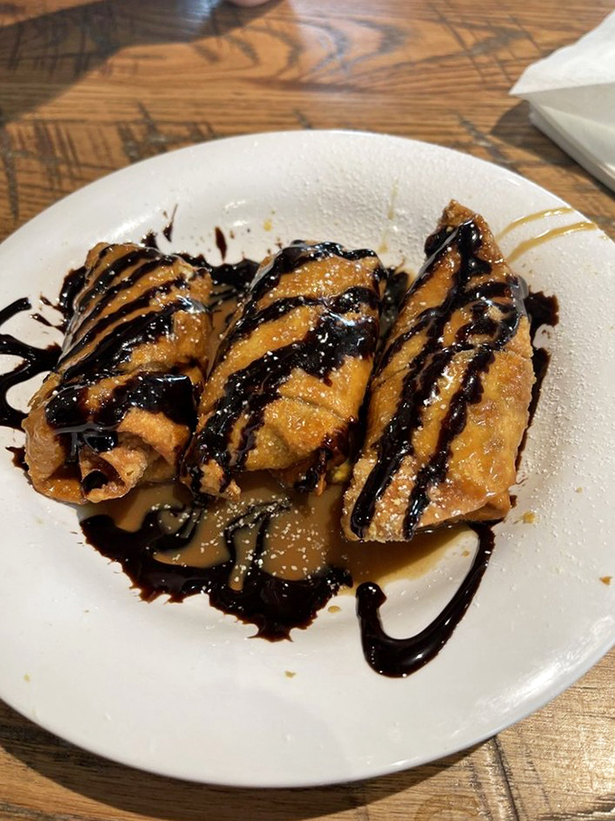 Dessert masquerading as breakfast, and we're all for it. These caramelized banana delights drizzled with chocolate sauce deserve their own fan club.