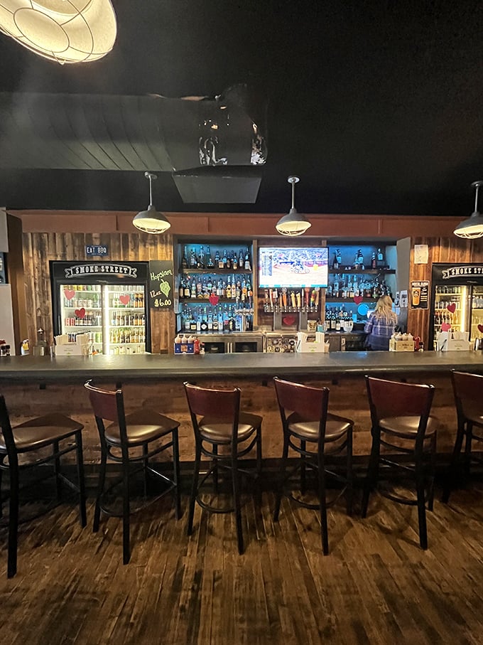 A bar that understands priorities: good lighting, ample seating, and enough spirits to complement whatever smoky delights await your table.