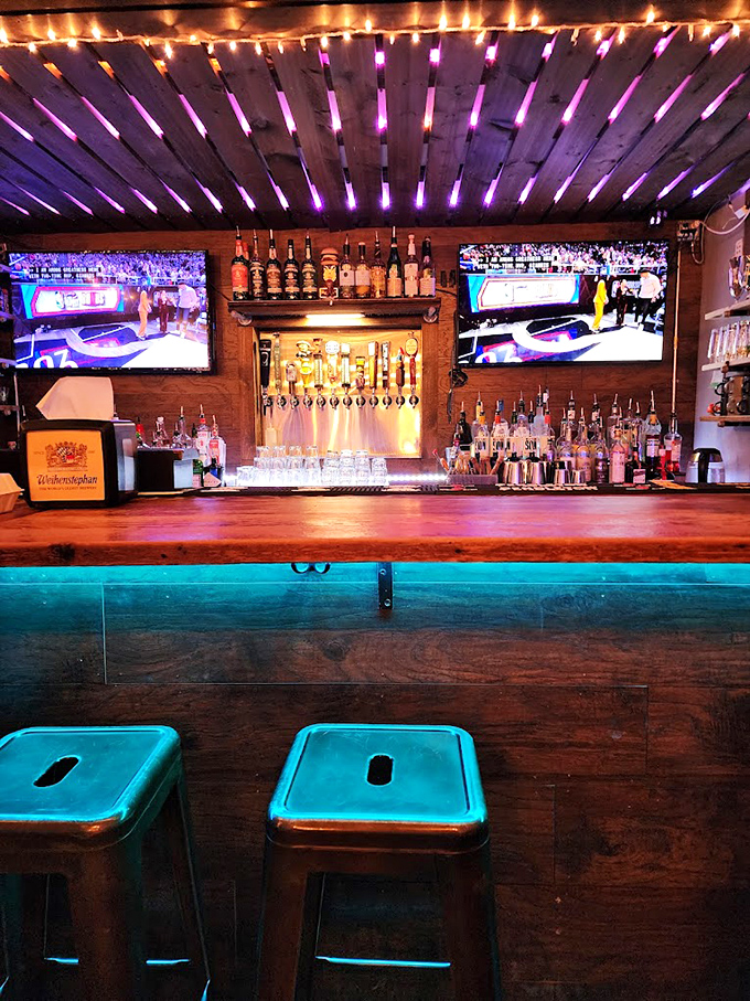 This isn't just a bar&mdash;it's command central for burger operations, where craft beer flows and sports play while patties sizzle nearby.