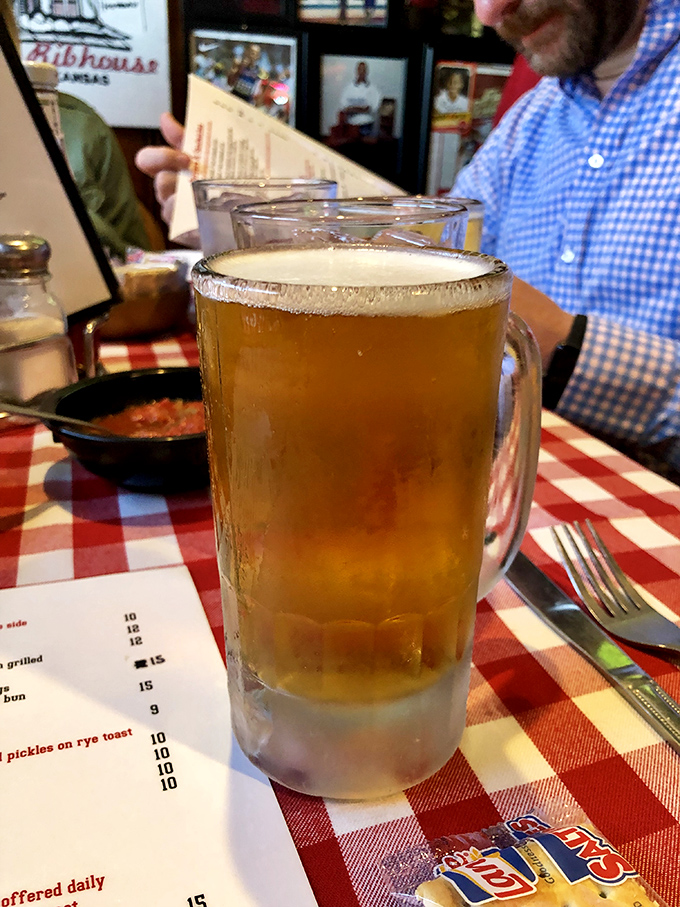 A frosty mug of beer stands at the ready, serving as the perfect palate refresher between bites of Herman's legendary beef and pork offerings.